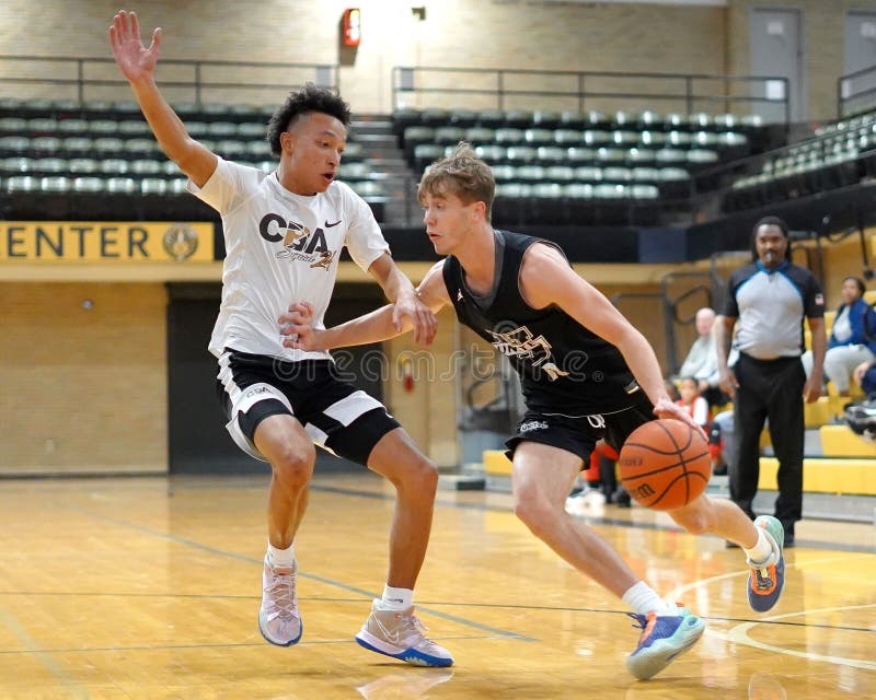 Basketball Player Dribbling the Ball into the Hoop Editorial Stock ...