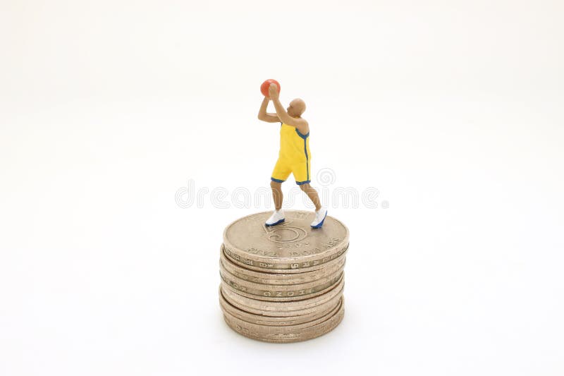 The Basketball Player Figure with Stack of Coins Stock Photo - Image of ...