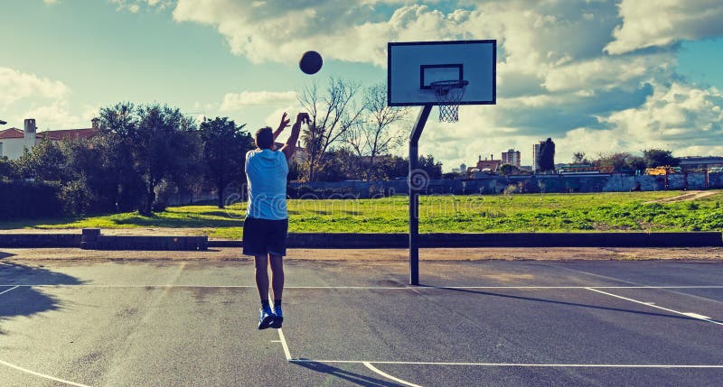 Basketball Player Seen from Behind Stock Image - Image of action, ball ...