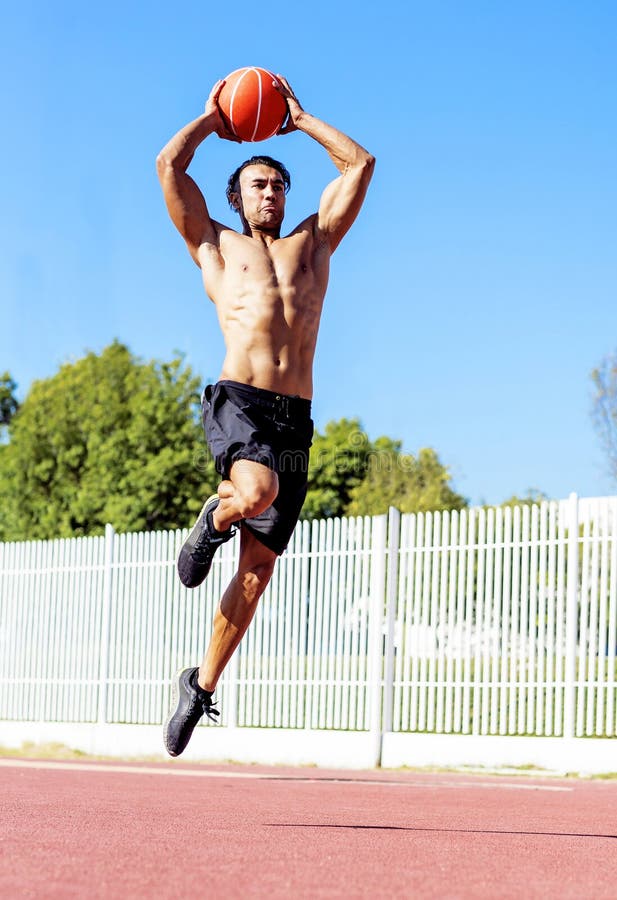 Muscular Young Man Shirtless Holding Basketball Stock Images - Download ...