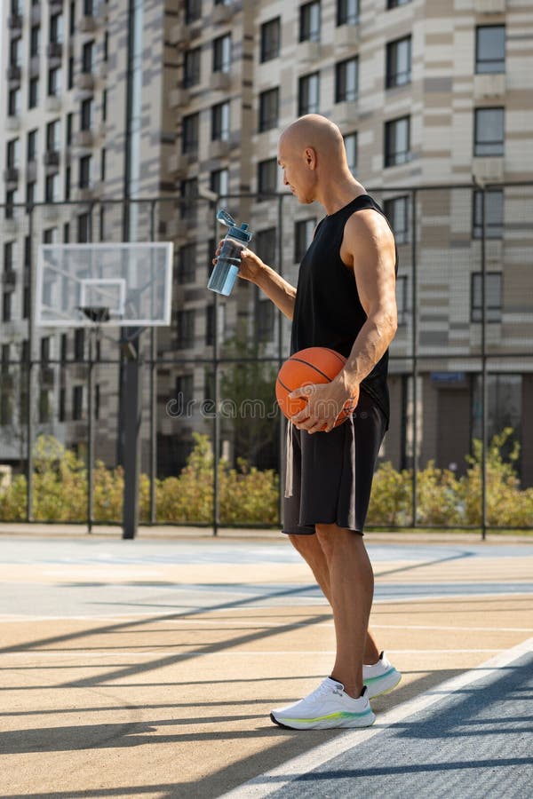 Basketball Player Eating Protein Energy Bar. Stock Image - Image of ...