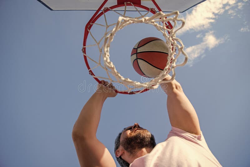 Basketball Player Throws the Ball into the Hoop Outdoor, Targeting ...