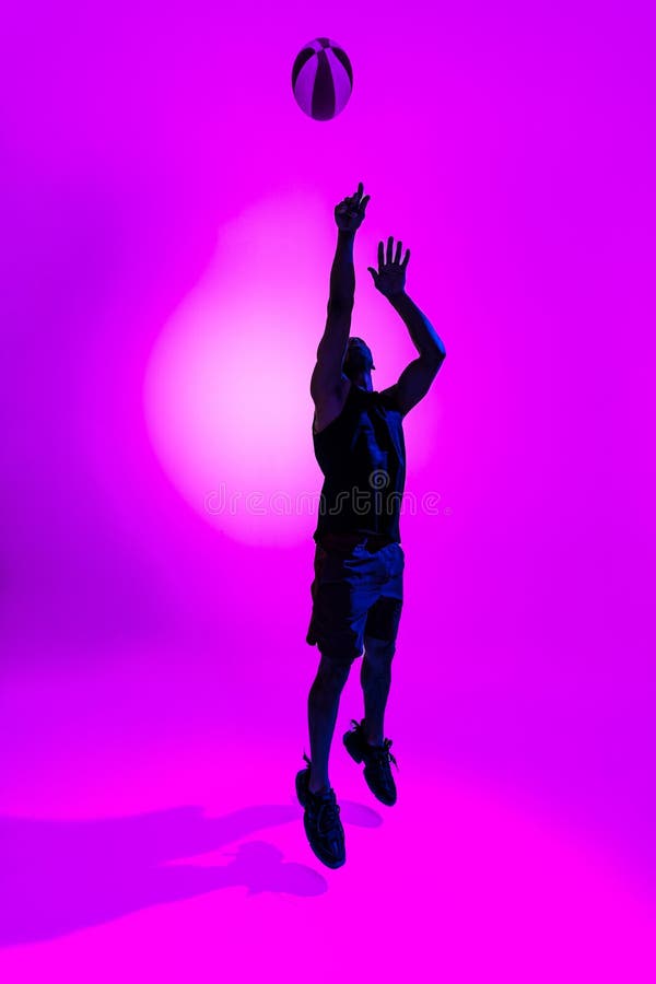 Basketball Player Throws the Ball on Studio Background. Advertising ...