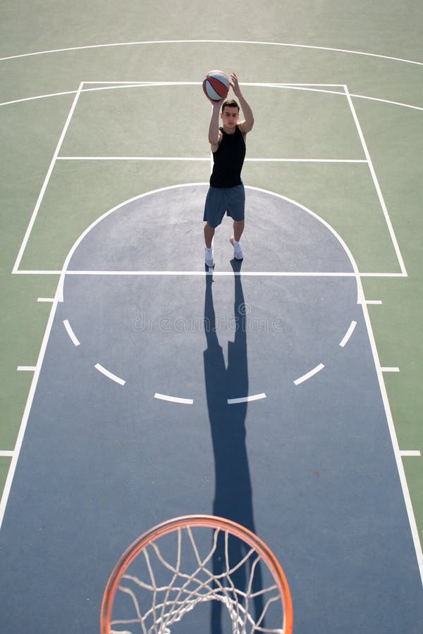 Angle View of Man Playing Basketball, Above Hoop of Man Shooting ...