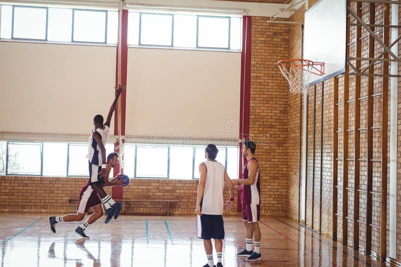 Basketball Players Playing in the Court Stock Photo - Image of ...