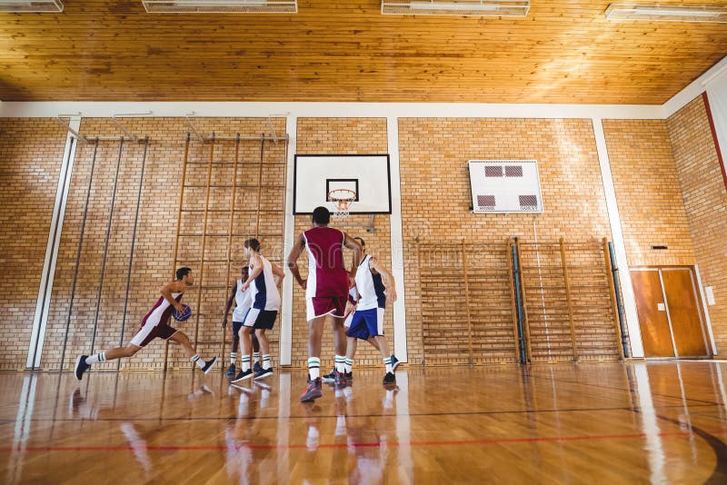 Basketball Players Playing in the Court Stock Image - Image of ...
