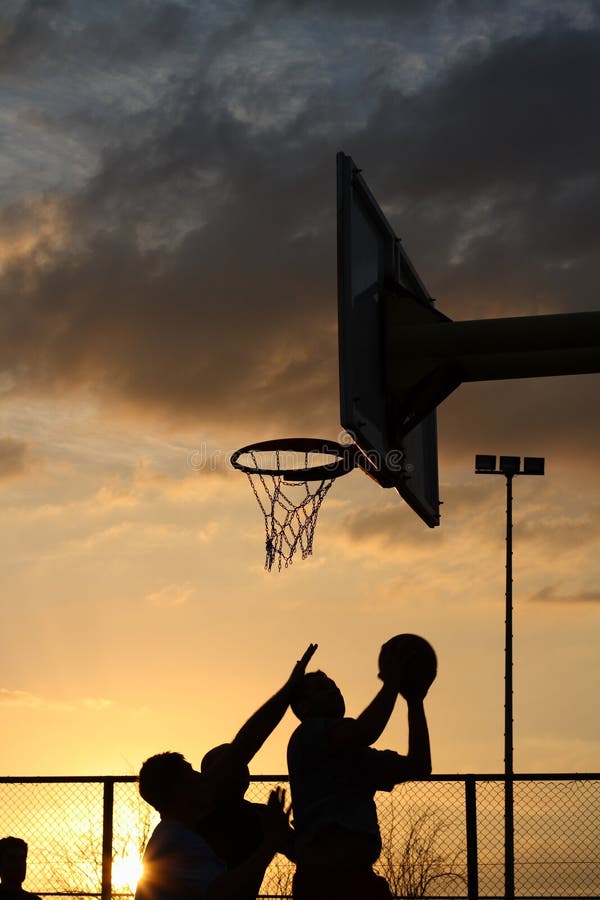 Basketball Players at the Sunset Stock Photo - Image of game, points ...
