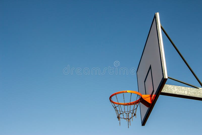 Basketball Ring with a Blue Sky Background. Down View Stock Photo ...