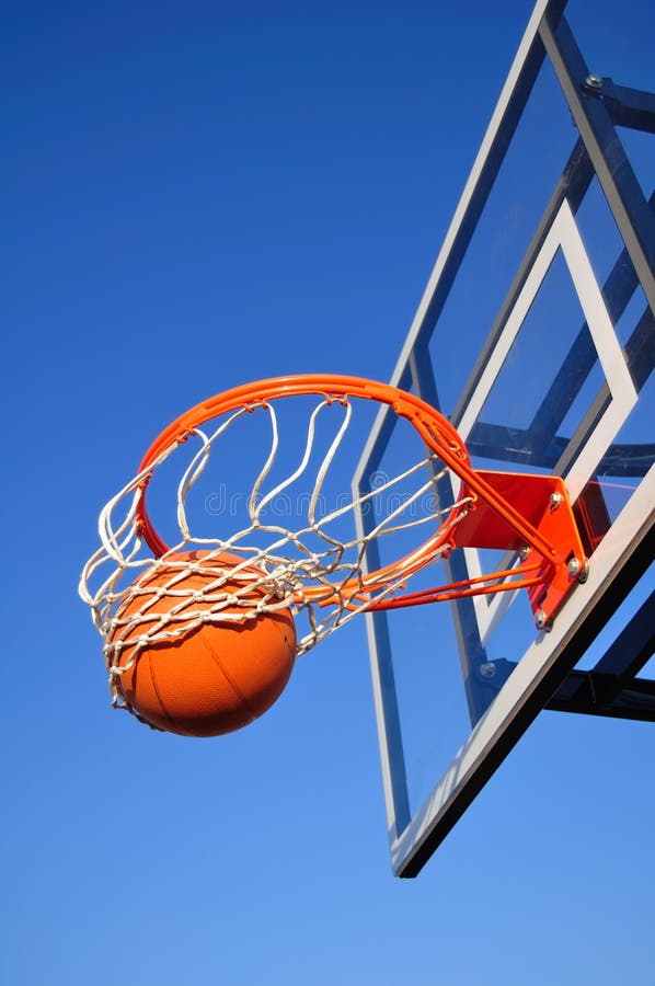Basketball Shot Falling through the Net, Blue Sky Stock Photo - Image ...