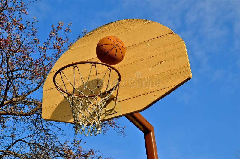 Basketball Sits on an Old Rim and Backboard Stock Photo - Image of ...
