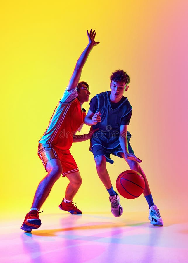 Basketball Training with Two Dedicated Athletes in Neon Light Against ...