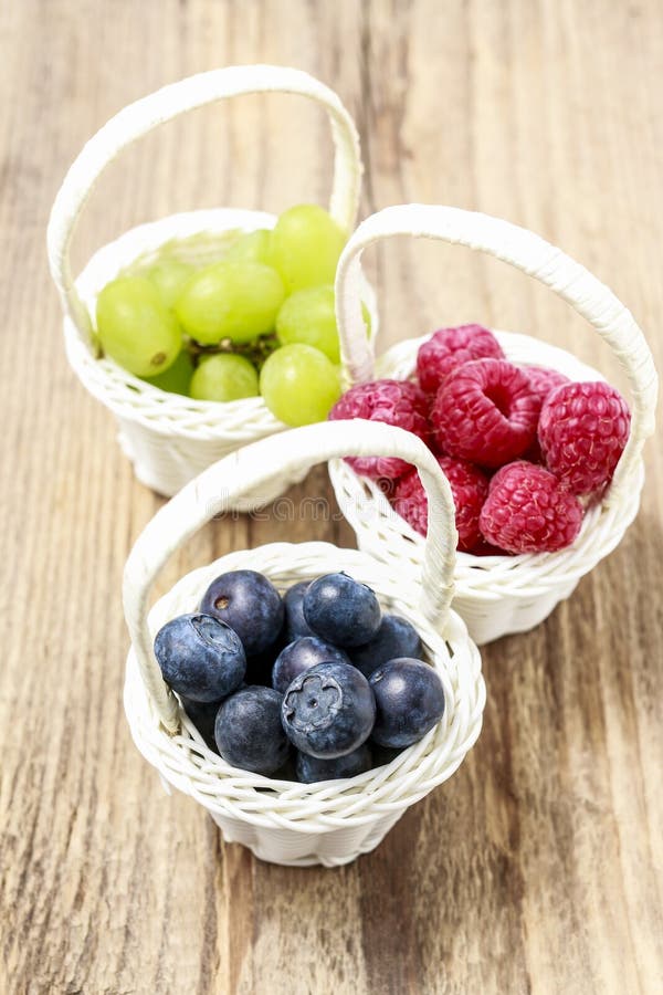 Baskets with Fruits: Raspberry, Blueberry and Grapes Stock Image ...