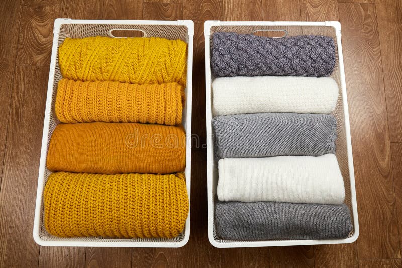 Baskets with Neat Stacks of Knitted Woolen Clothes . Organization of ...