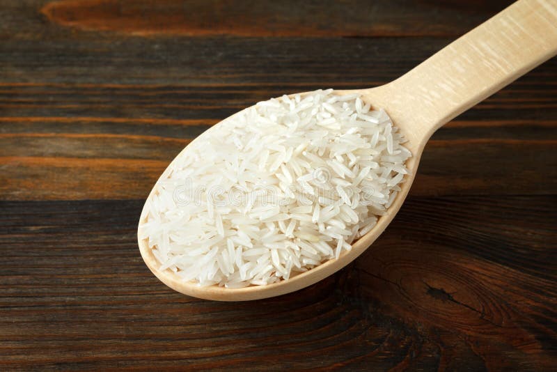 Basmati Rice in a Wooden Spoon Stock Image - Image of spoon, basmati ...
