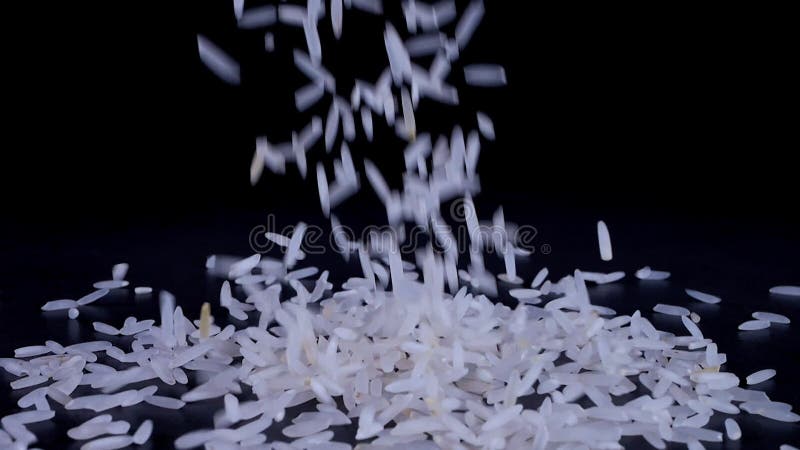 Basmati White Rice Falling on a Black Background Stock Video - Video of ...