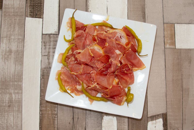 Basque Plate of Hams and Peppers on Wood Table Stock Image - Image of ...