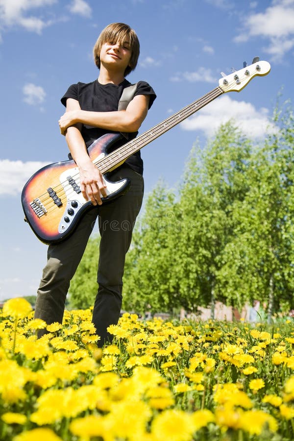 Bass player stock image. Image of field, little, boys - 13519329