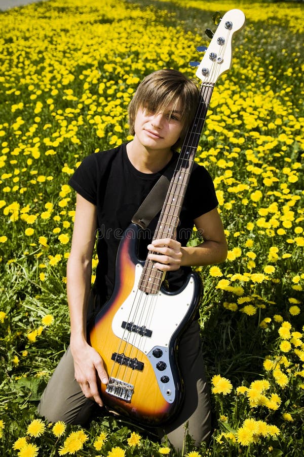 Bass player stock photo. Image of teens, field, rock - 13519880