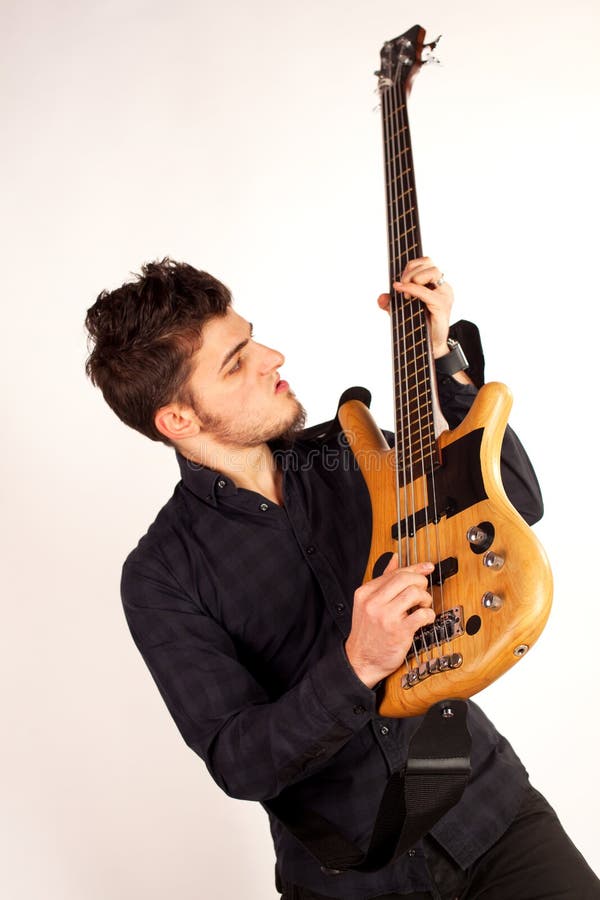 Bass Player Looking at His Instrument Stock Photo - Image of passionate ...