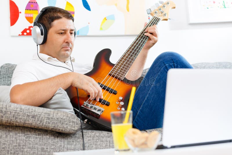 Bass player stock image. Image of couch, guitar, nelectric - 59458573