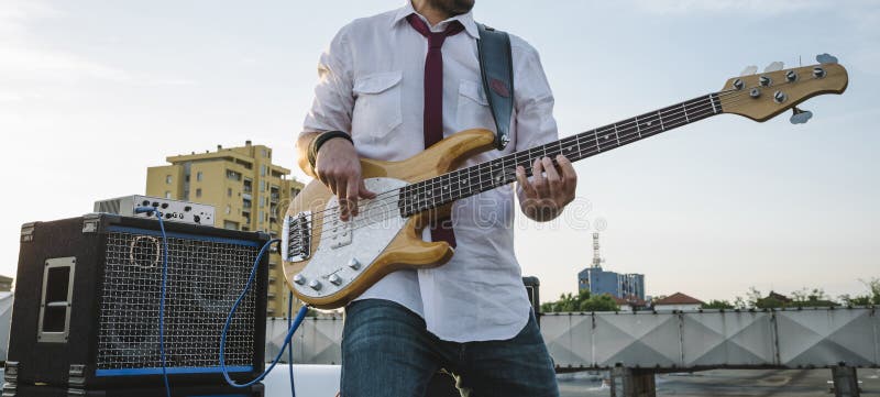 Bass Player Playing Outdoors Stock Photo - Image of sunset, show: 228352796