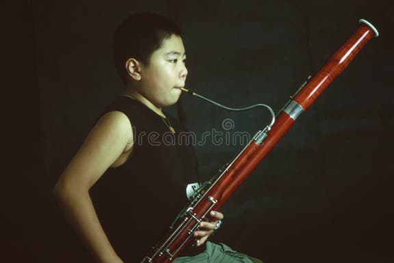 A bassoon boy stock photo. Image of color, grand, music - 17545054