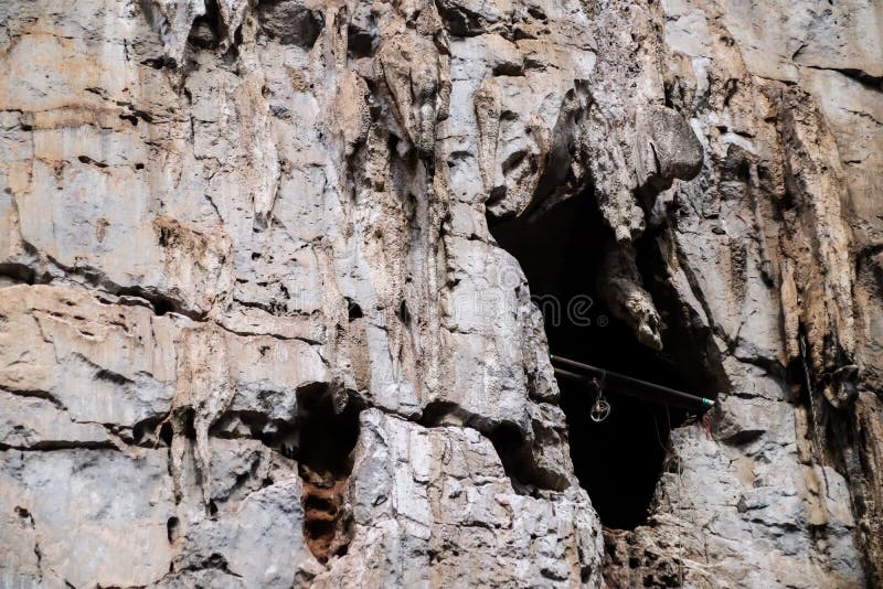 Bat Cave Entrance on Cliff of Rock Mountain Stock Image - Image of ...