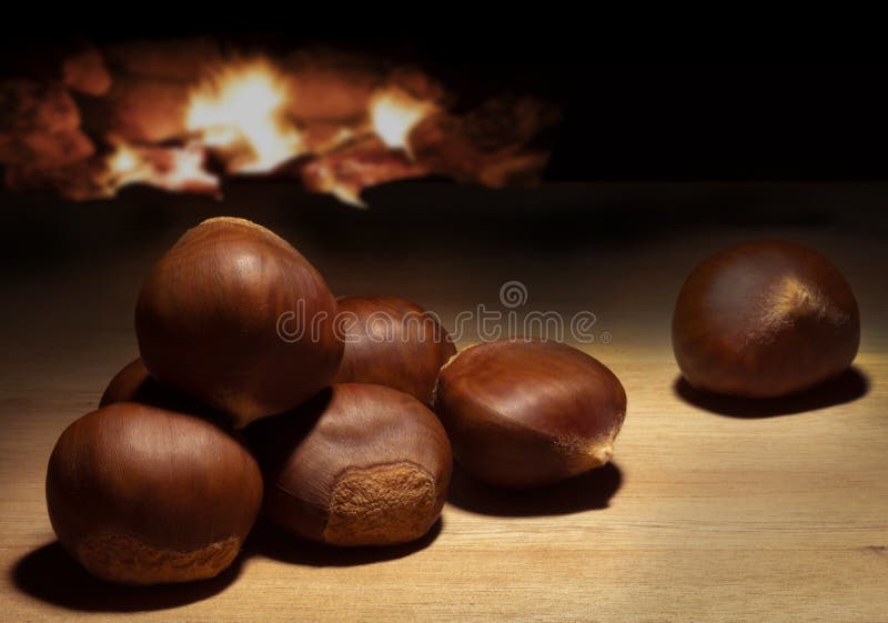 Batch of Chestnuts on a Table with Fire Behind Stock Image - Image of ...