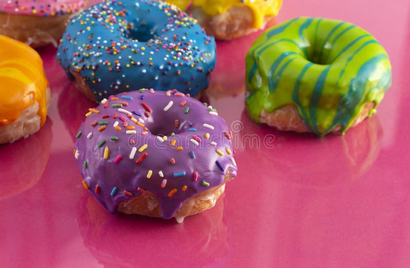 Batch of Rainbow Colored Glazed Donuts Stock Image - Image of pastry ...