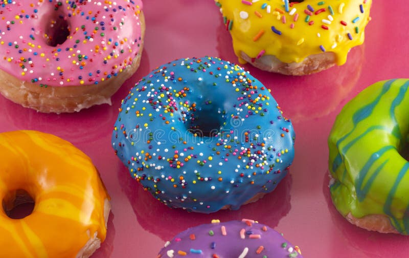 Batch of Rainbow Colored Glazed Donuts Stock Photo - Image of food ...