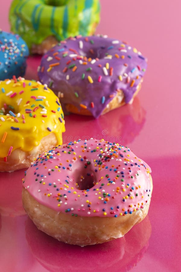 Batch of Rainbow Colored Glazed Donuts Stock Photo - Image of doughnut ...