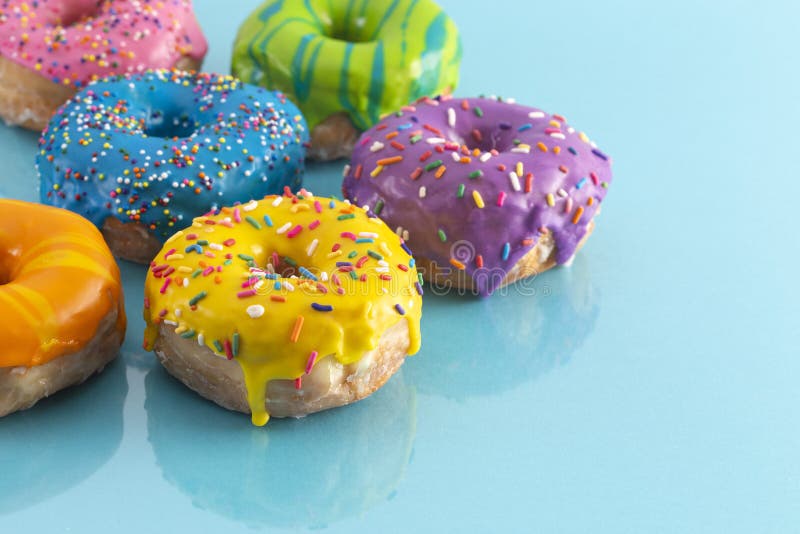 Batch of Rainbow Colored Glazed Donuts Stock Image - Image of pastry ...