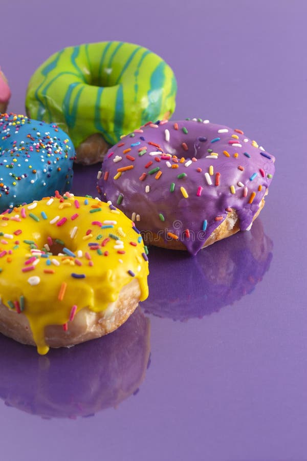 Batch of Rainbow Colored Glazed Donuts Stock Photo - Image of food ...