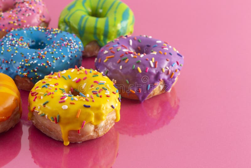 Batch of Rainbow Colored Glazed Donuts Stock Photo - Image of doughnut ...