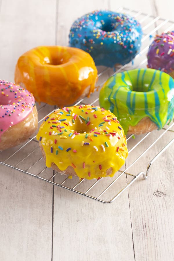 Batch of Rainbow Colored Glazed Donuts Stock Image - Image of dozen ...