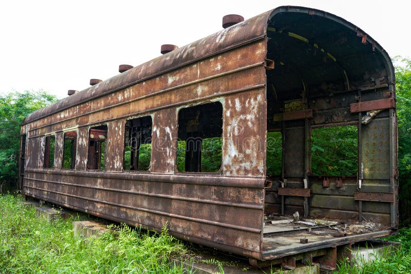 A Batch of Rusty Train Carriages Abandoned in the Forest Stock Image ...