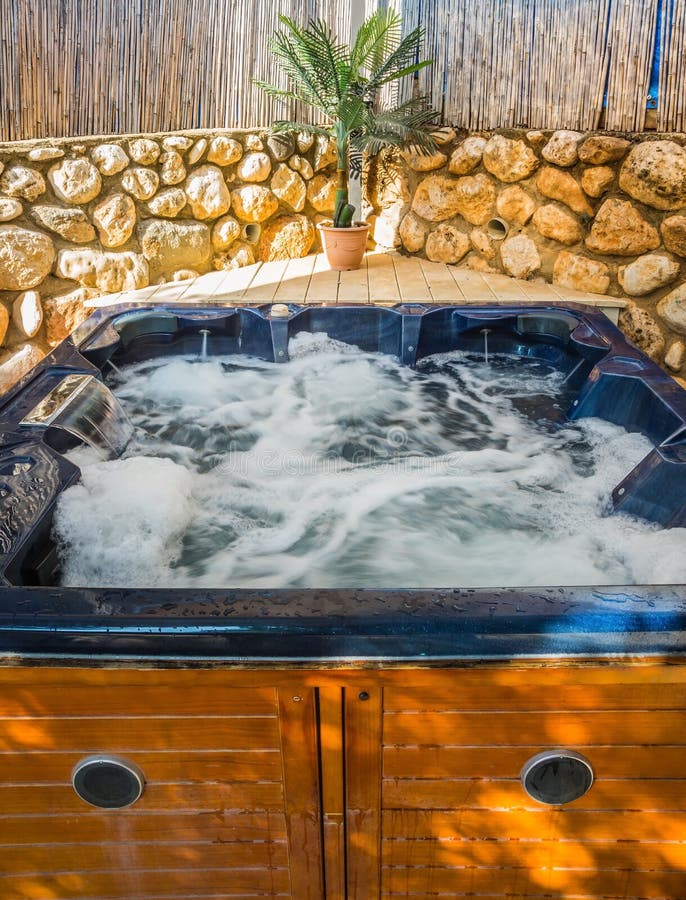 Jacuzzi in the garden stock image. Image of property - 72768189