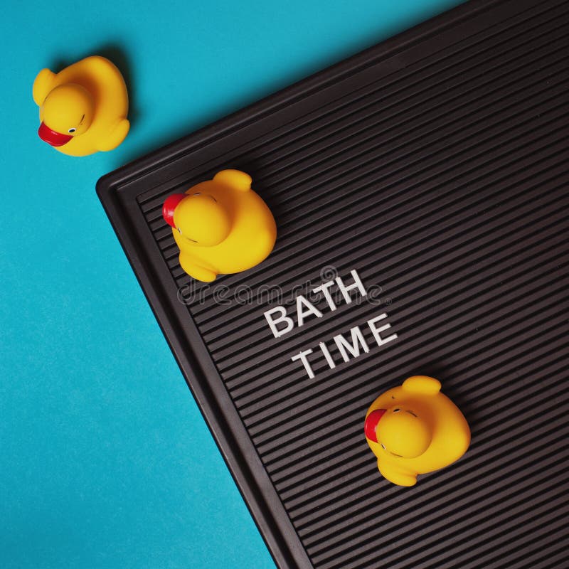 Bath Time - Text on Black Letter Board with Yellow Rubber Ducks on Blue ...