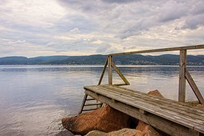 Bathig Ladder with Rustic Worn Wood and Nice Cloudy View Stock Photo ...