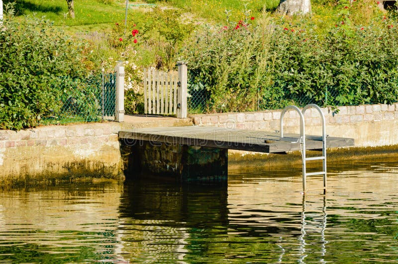 Bathing Jetty and Landing Stage for Boats with Blue Water Stock Photo ...