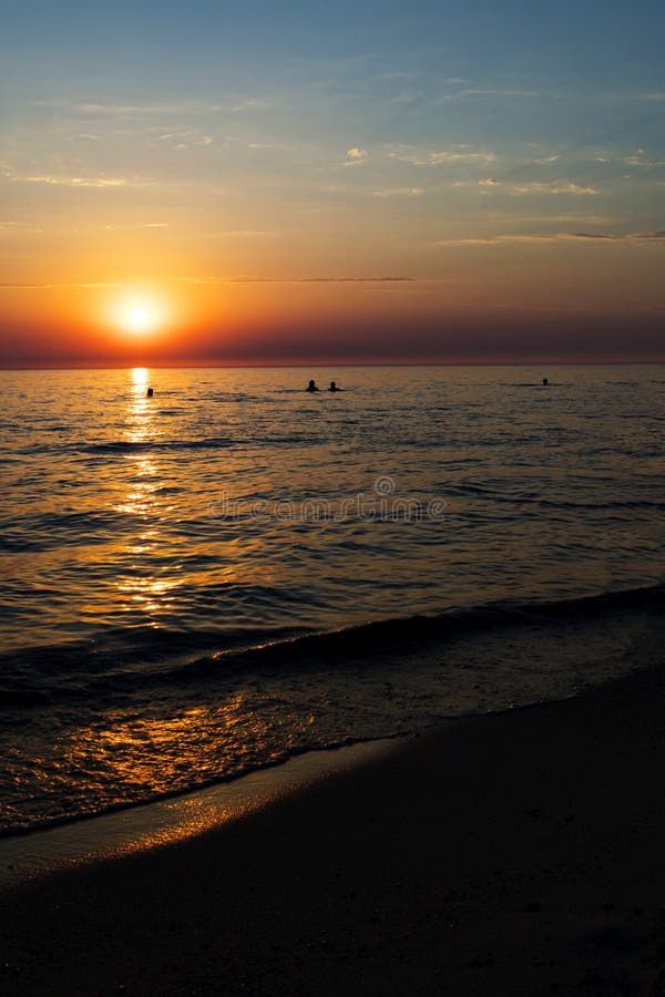 Bathing People in the Sea at Sunset. Rest, Vacation. Stock Photo ...