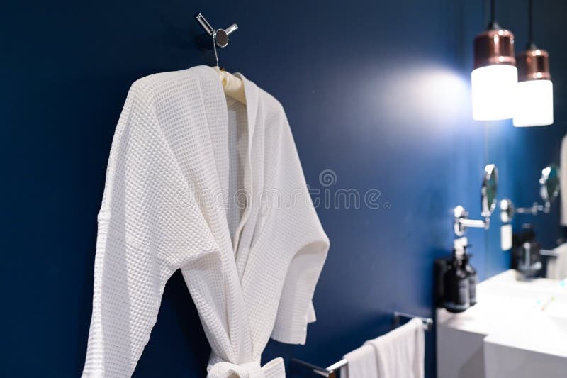 Bathrobe Hanging on Blue Wall Stock Image - Image of fashion, blue ...