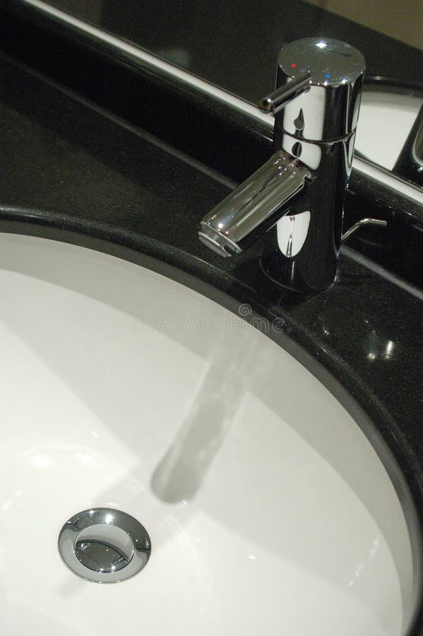 Bathroom Faucet stock image. Image of sleek, house, interior - 3555035