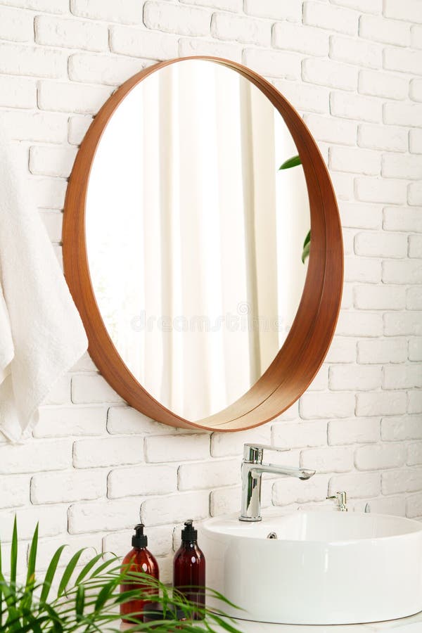 Bathroom Interior with Circle Shaped Mirror in Wooden Frame and White ...