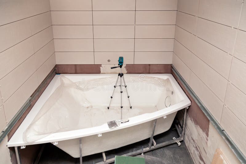 Bathroom Interior Repair, Laying Tiles on Walls Stock Photo - Image of ...