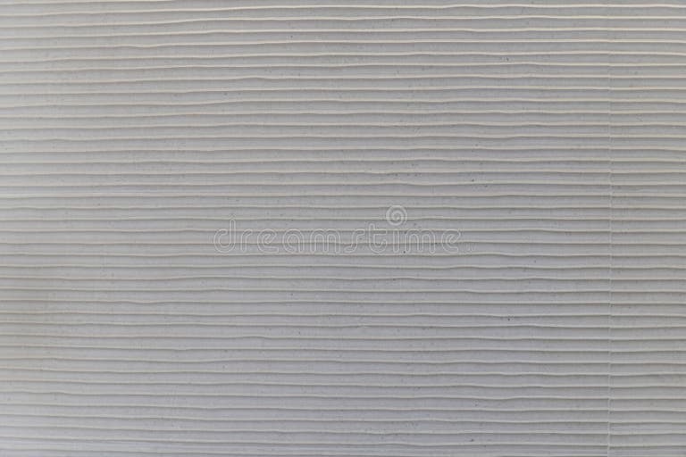 A Bathroom Wall with Light-colored Grated Tiles in a Modern Style Stock ...