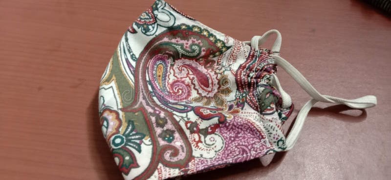 The Batik-style Cloth Mask on the Table is Red Stock Image - Image of ...