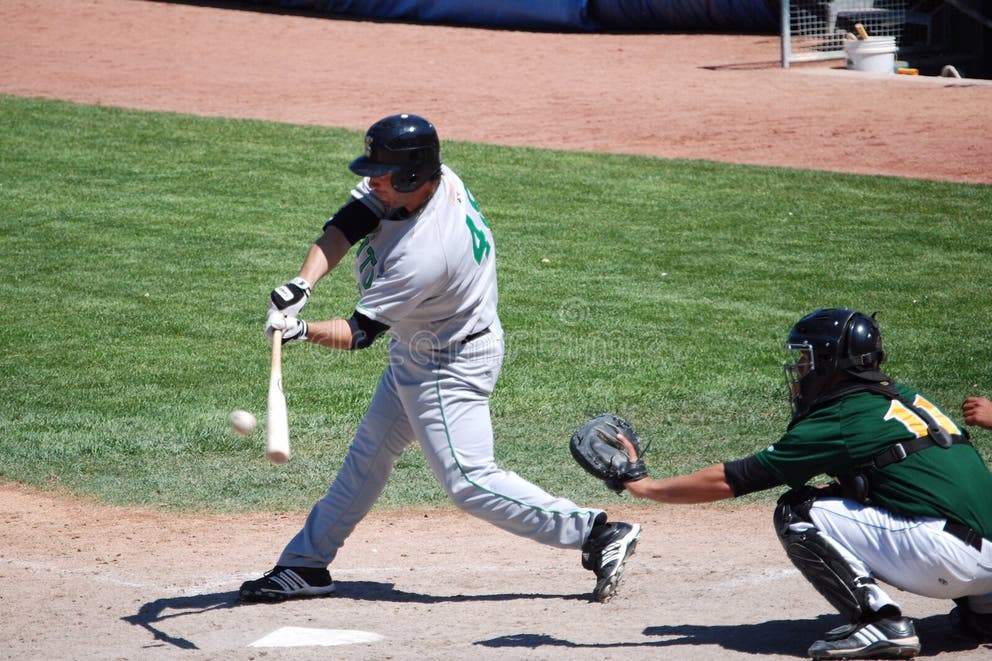 Batter hitting a ball editorial photo. Image of bend, catching - 9631521