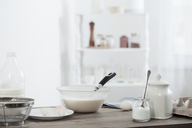 Batter on Wooden Table in White Kitchen Stock Photo - Image of liquid ...