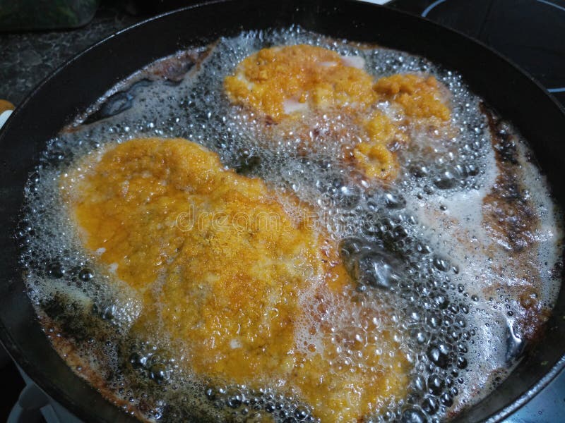 Battered Pork Frying in Deep Oil Stock Photo - Image of iron, battered ...